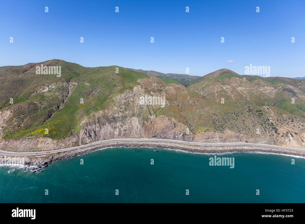 Aerial view of Pacific Coast Highway and rugged cliffs north of Malibu ...