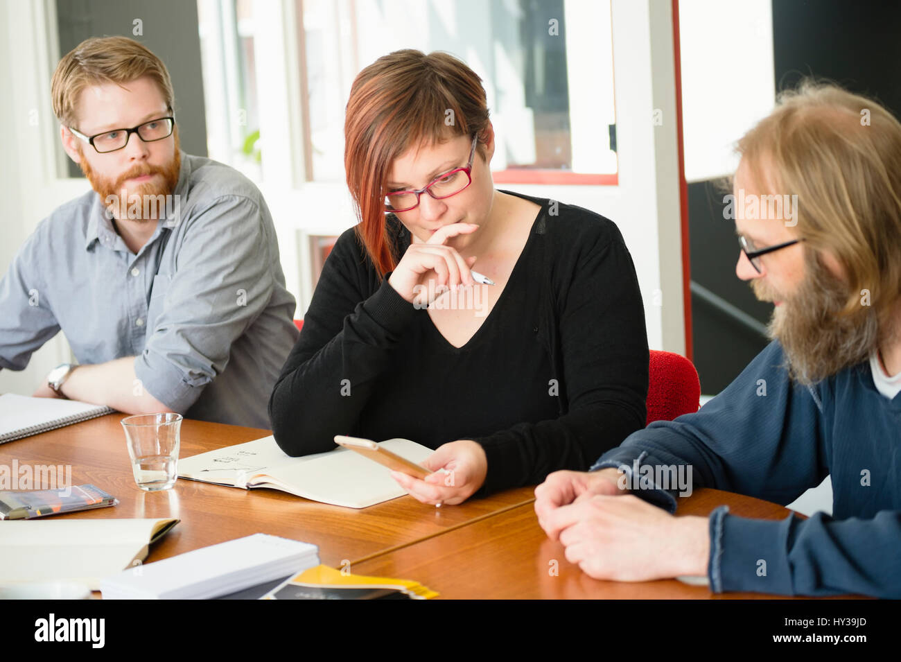 Sweden, People sharing ideas during work meeting Stock Photo - Alamy