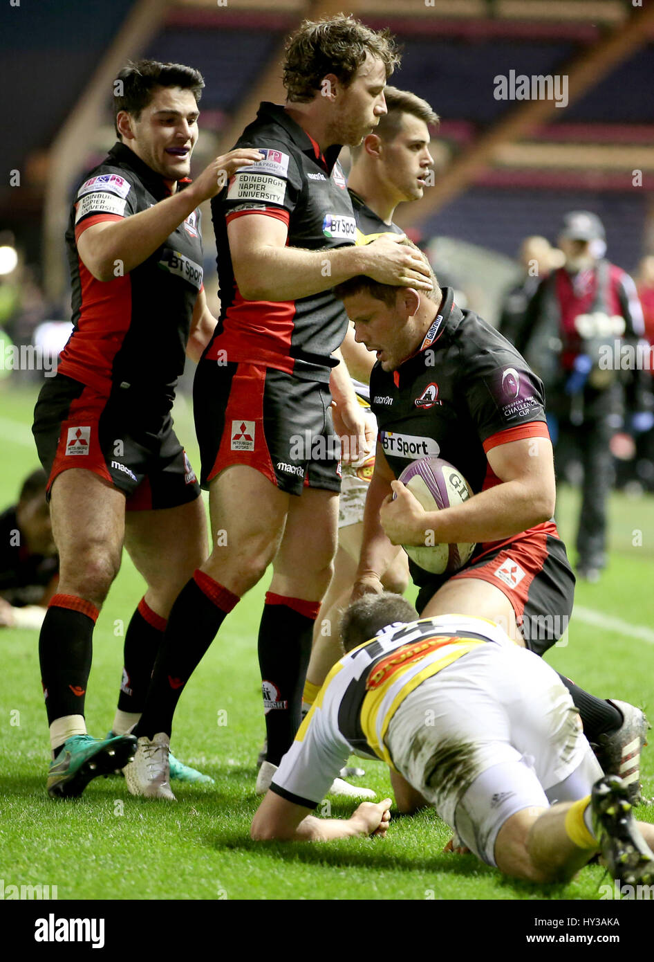 Edinburgh's Ross Ford (right) celebrates scoring his sides second try ...
