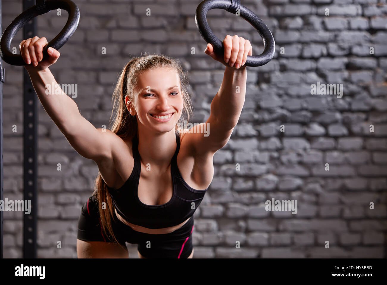 Muscular woman stretching in crossfit hi-res stock photography and ...