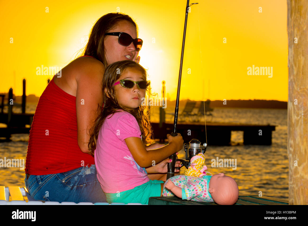 Mom And Little Girl Fishing High Resolution Stock Photography and ...