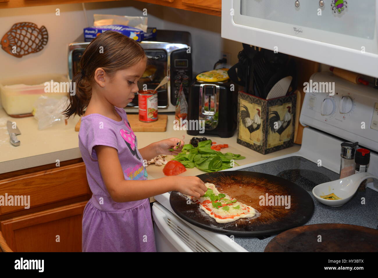 young girl cooking pizza in kitchen Stock Photo - Alamy
