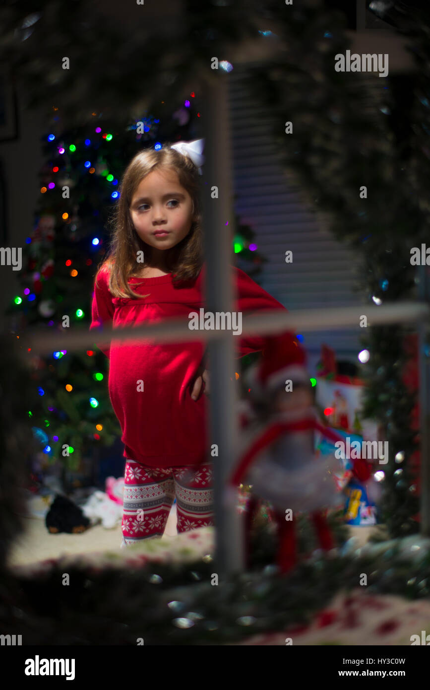 looking through window Christmas at girl Stock Photo - Alamy