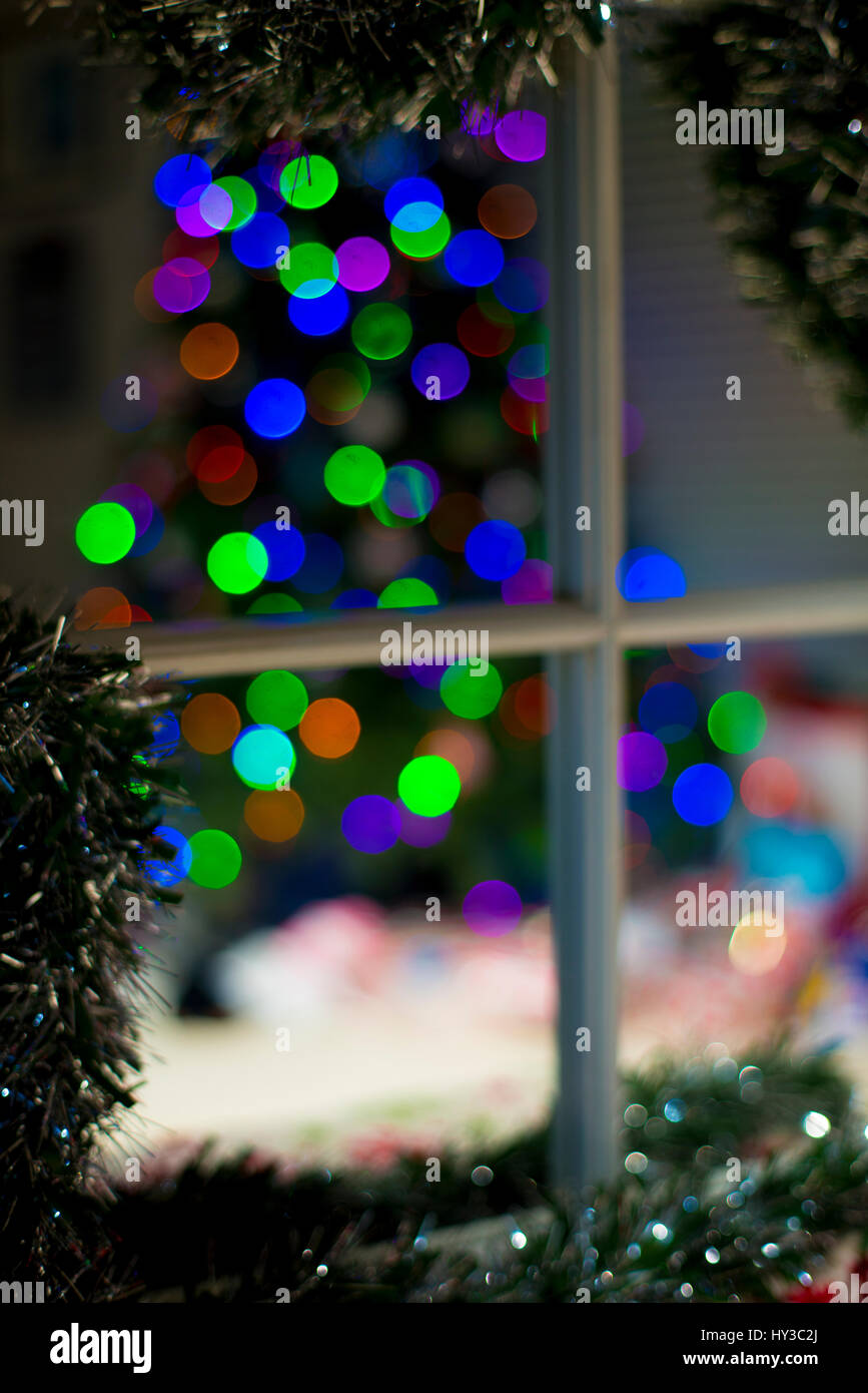 out of focus tree lights looking through window Christmas Stock Photo ...