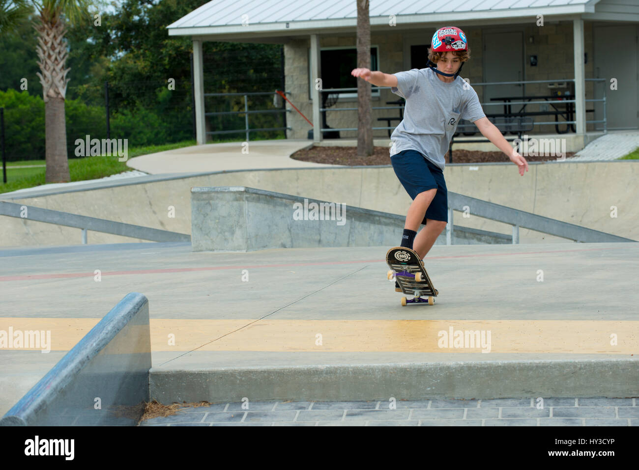 Young boy on skateboard hi-res stock photography and images - Alamy