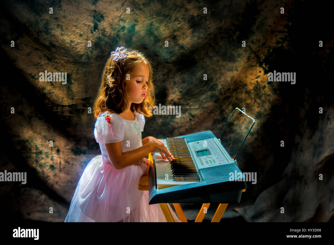 young girl with instrument holding keyboard Stock Photo - Alamy