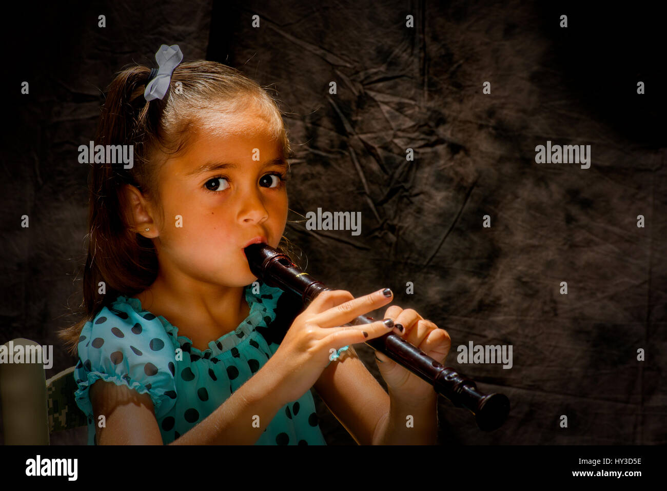 young girl playing recorder Stock Photo - Alamy