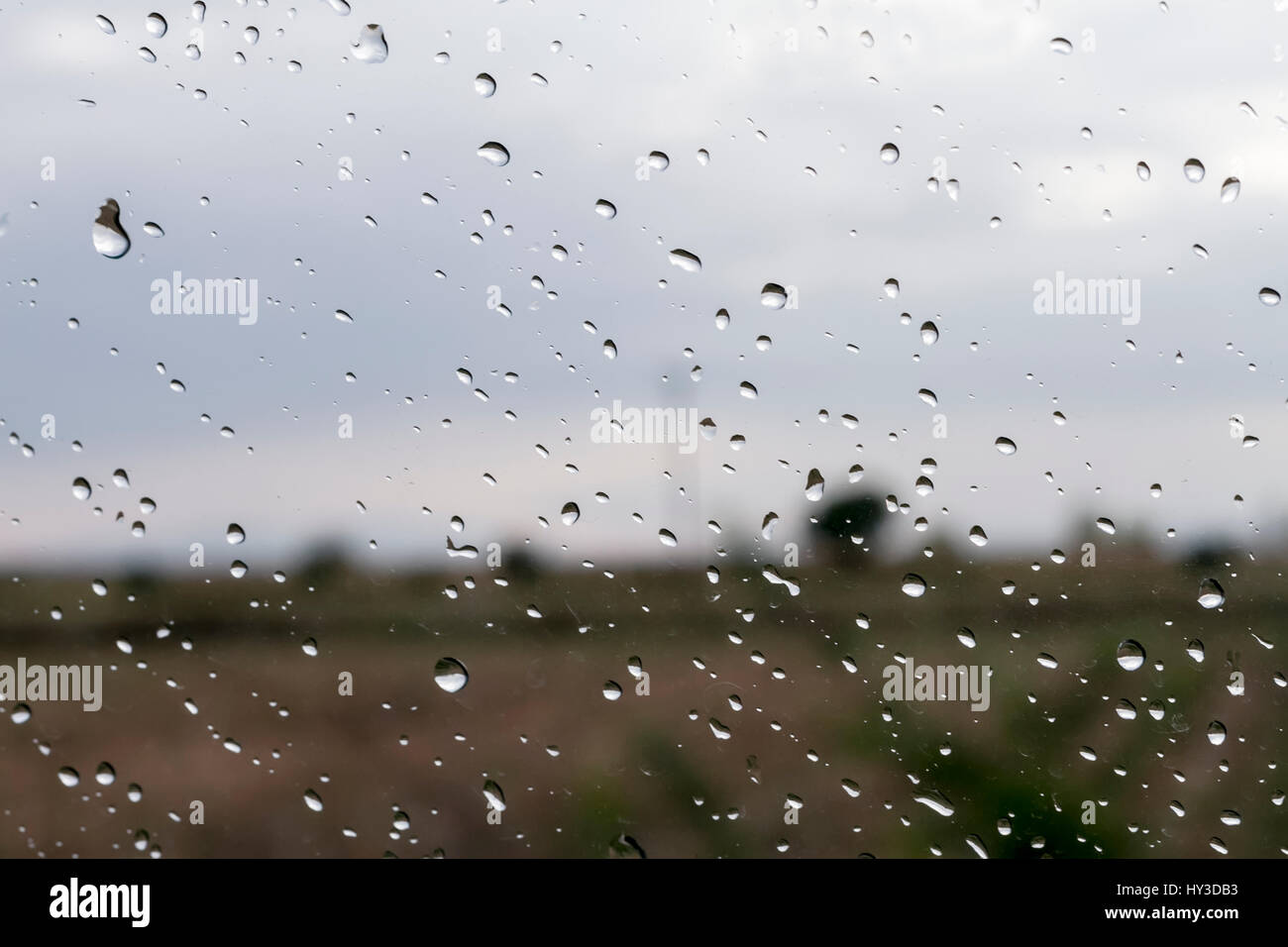 Natural water drops on window glass with nature background. Bokeh Stock ...