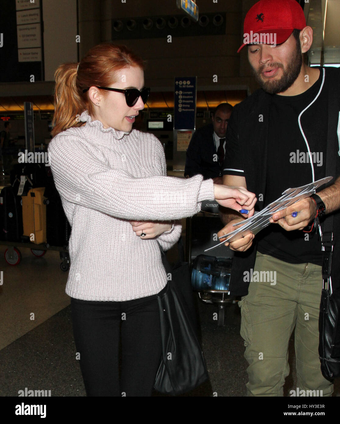 Emma Roberts holds hands with a mystery friend at Los Angeles ...