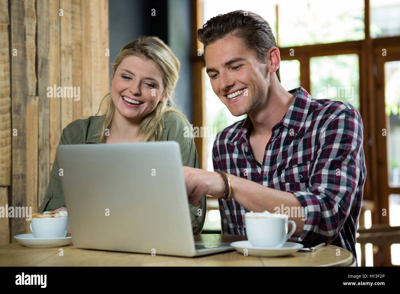 Loving couple table laptop hi-res stock photography and images - Alamy