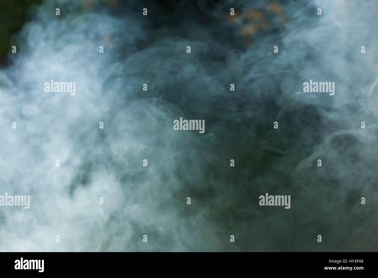 Sunlight shines through a dense smoke at a backyard barbecue Stock ...