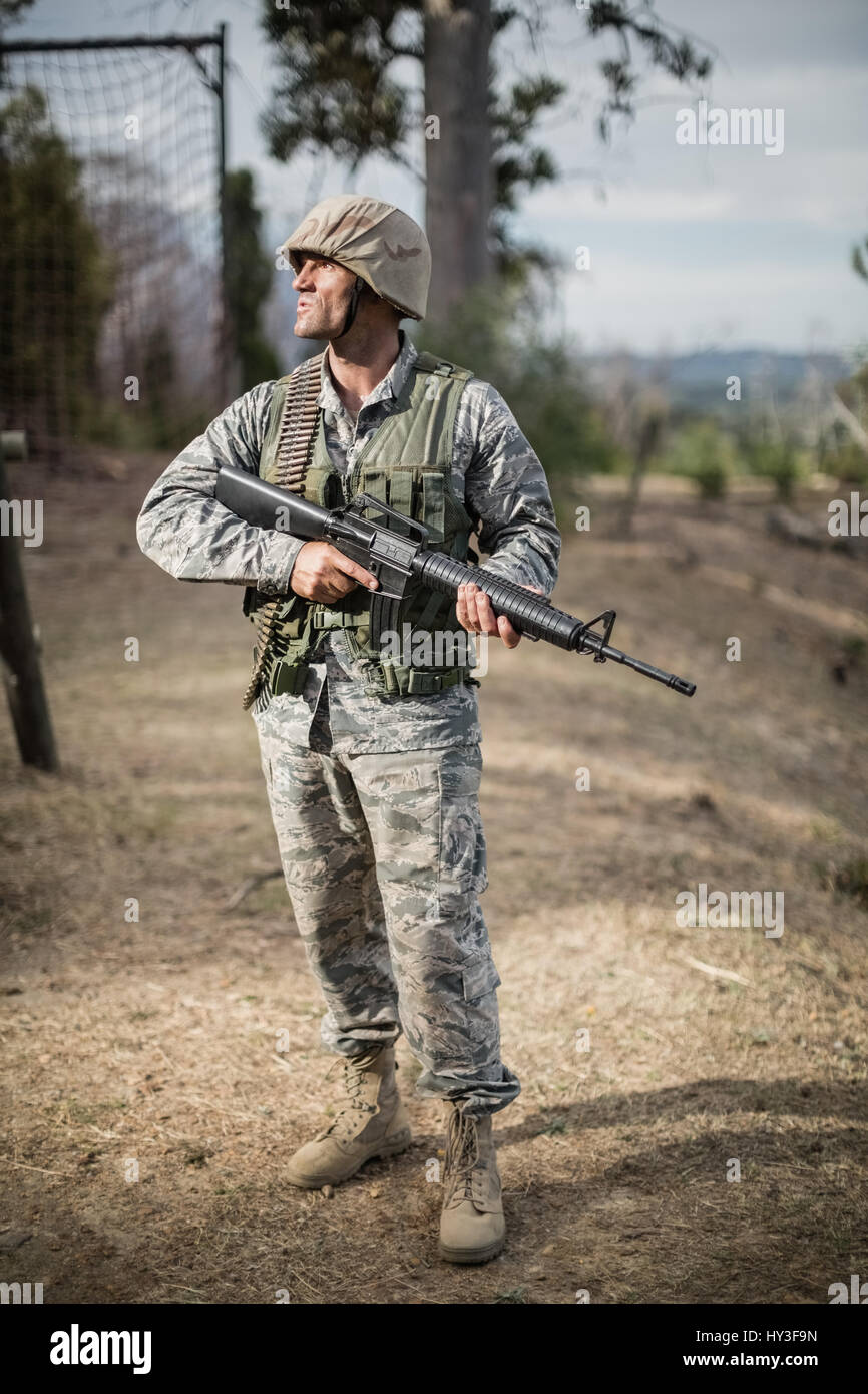 Military soldier during training exercise with weapon at boot camp ...
