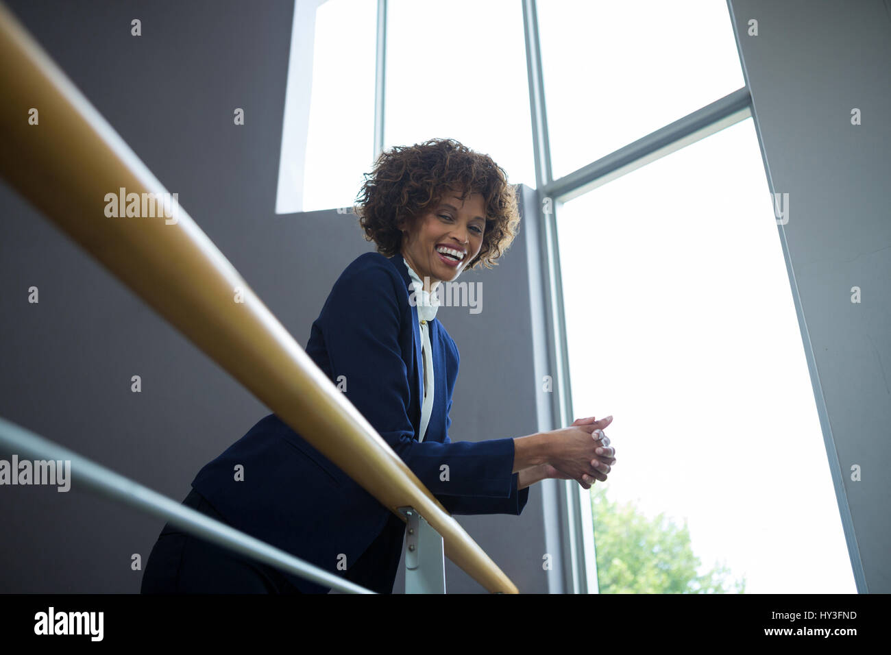 Leaning over railing hi-res stock photography and images - Alamy