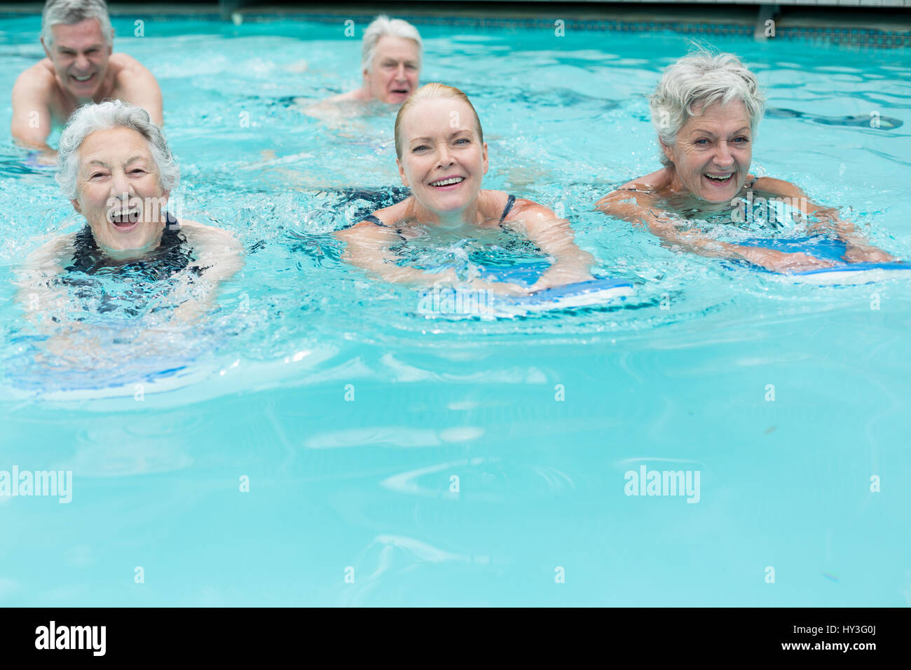 Portrait of senior swimmers enjoying in pool Stock Photo - Alamy