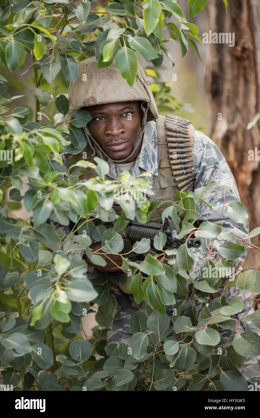 Military soldier guarding with a rifle in boot camp Stock Photo - Alamy