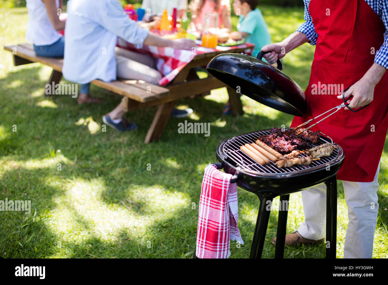 Barbequing hi-res stock photography and images - Alamy