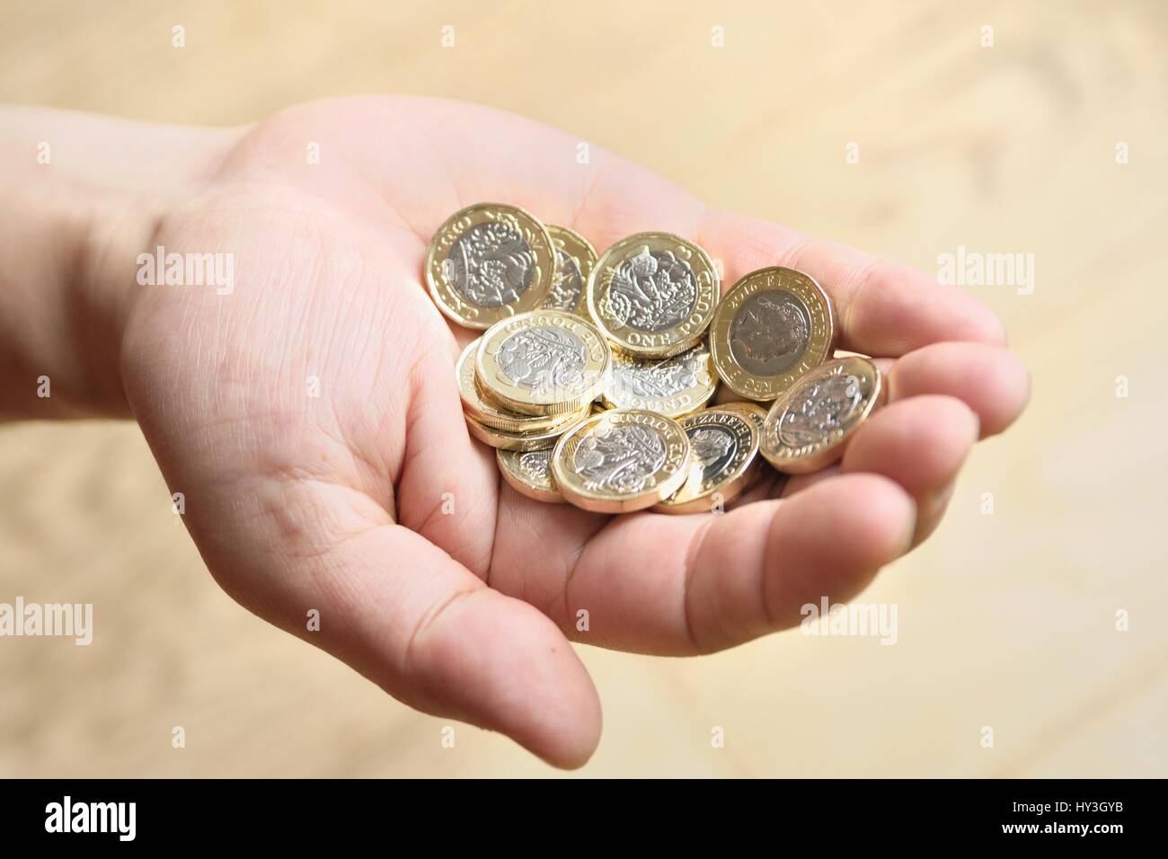 Handful of coins hi-res stock photography and images - Alamy