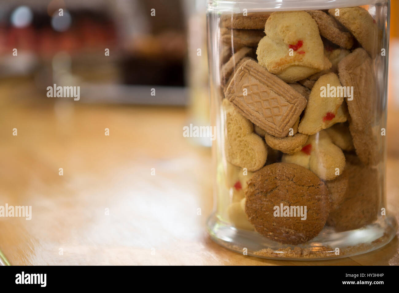 Variety of cookies in jar on counter at coffee shop Stock Photo - Alamy