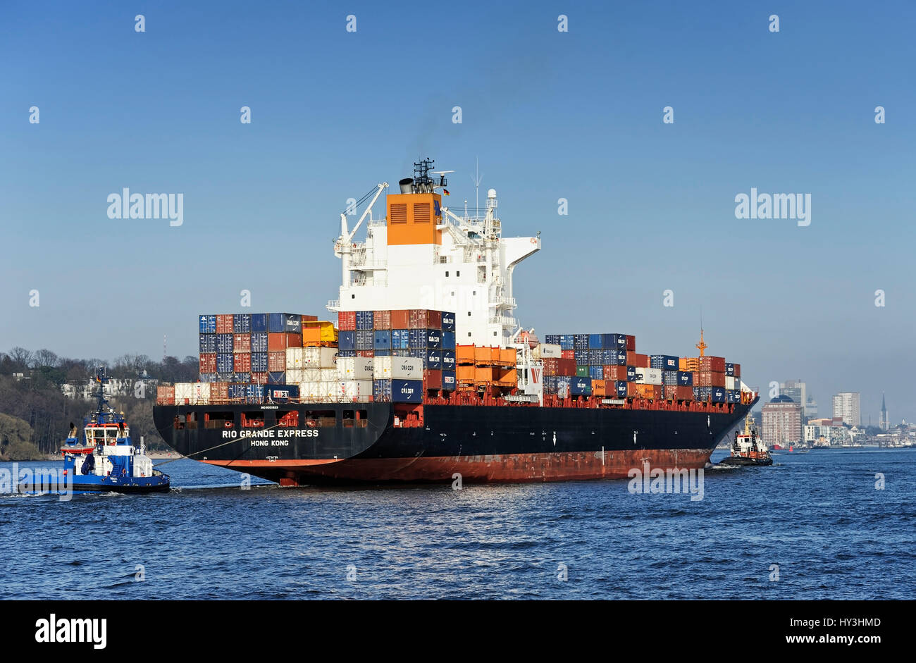 Container freighter Rio grandee express train on the Elbe by height ...