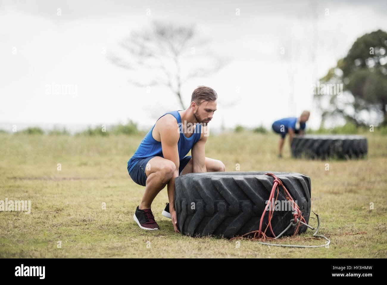 Man flipping tire hi-res stock photography and images - Alamy