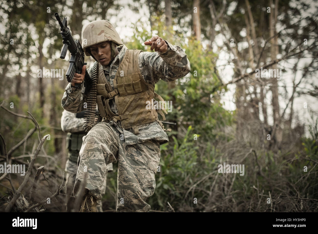 Military soldiers during training exercise with weapon at boot camp ...