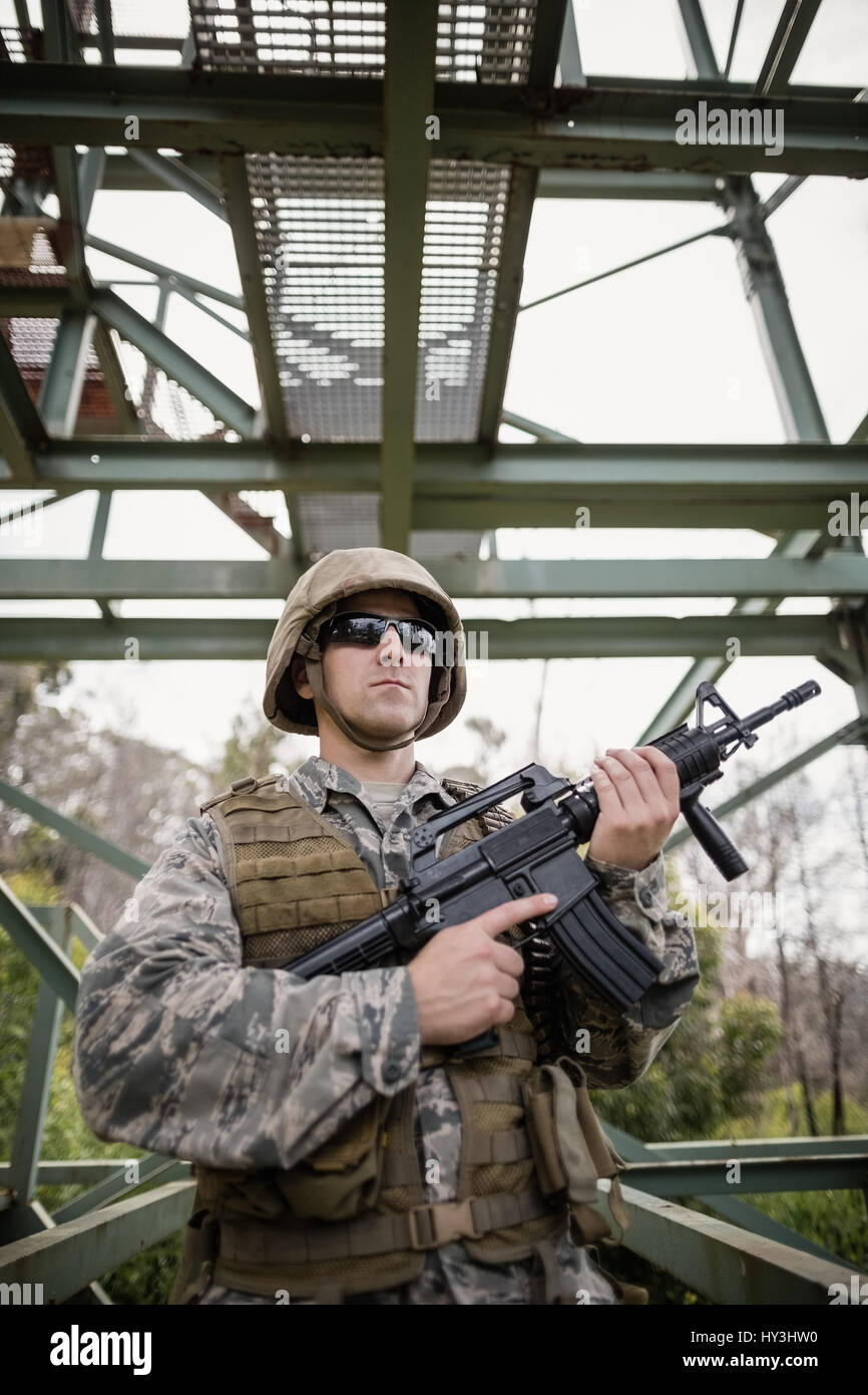 Military soldier guarding with a rifle in boot camp Stock Photo - Alamy