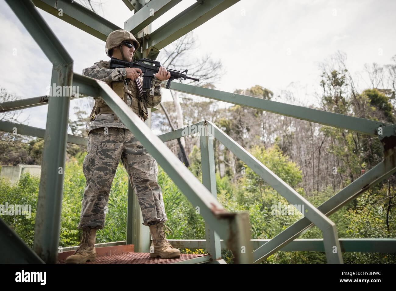 Military soldier guarding with a rifle in boot camp Stock Photo - Alamy