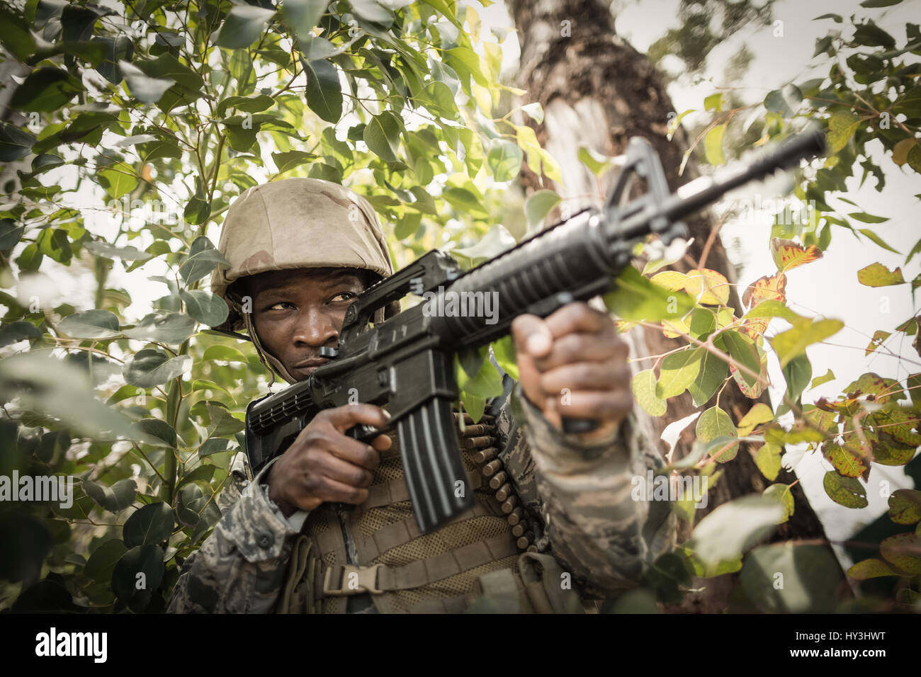 Military soldier guarding with a rifle in boot camp Stock Photo - Alamy
