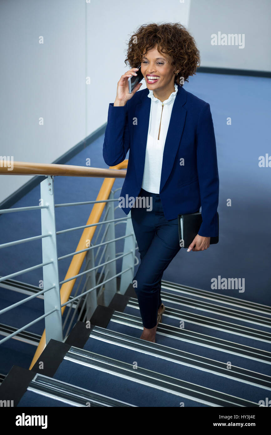 On phone climbing steps hi-res stock photography and images - Alamy