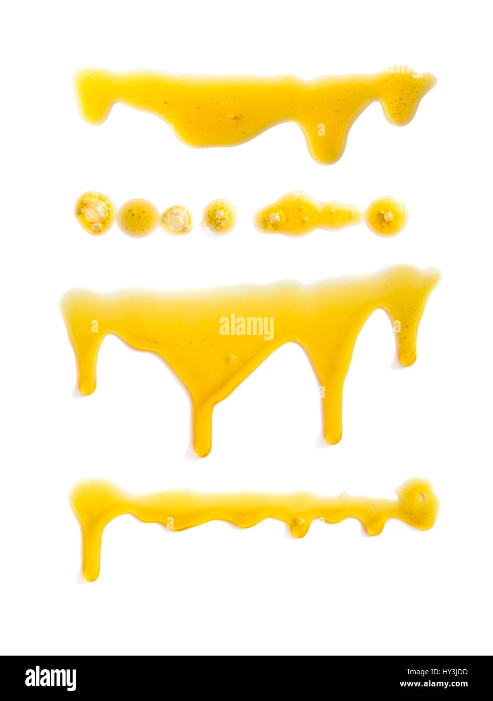 Set of stains of yellow oil and drops on a white background Stock Photo ...