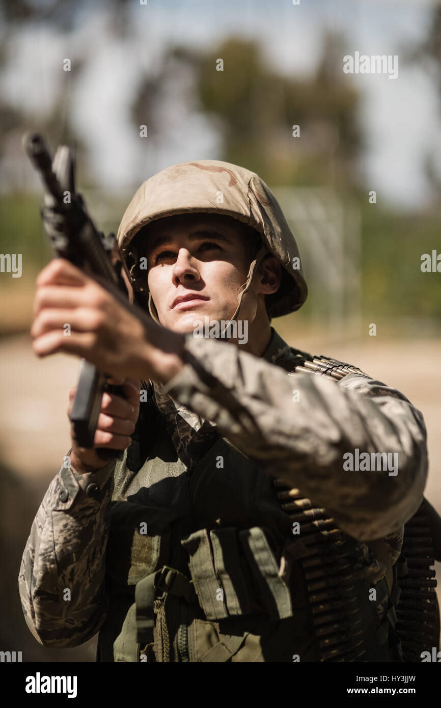 Military soldier aiming with a rifle in boot camp Stock Photo - Alamy