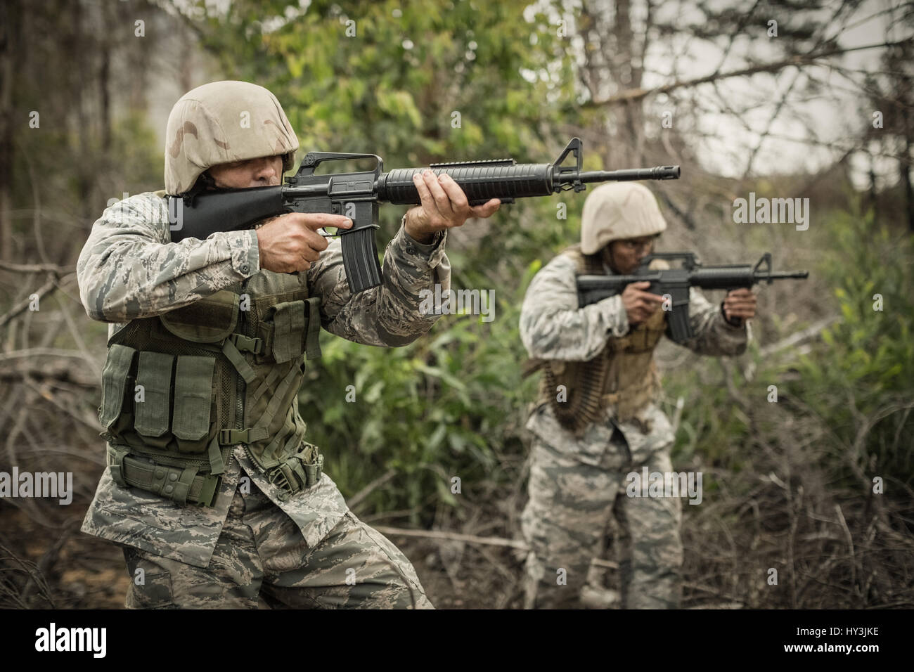 Military soldiers during training exercise with weapon at boot camp ...