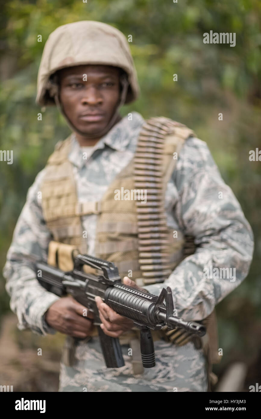 Military soldier guarding with a rifle in boot camp Stock Photo - Alamy