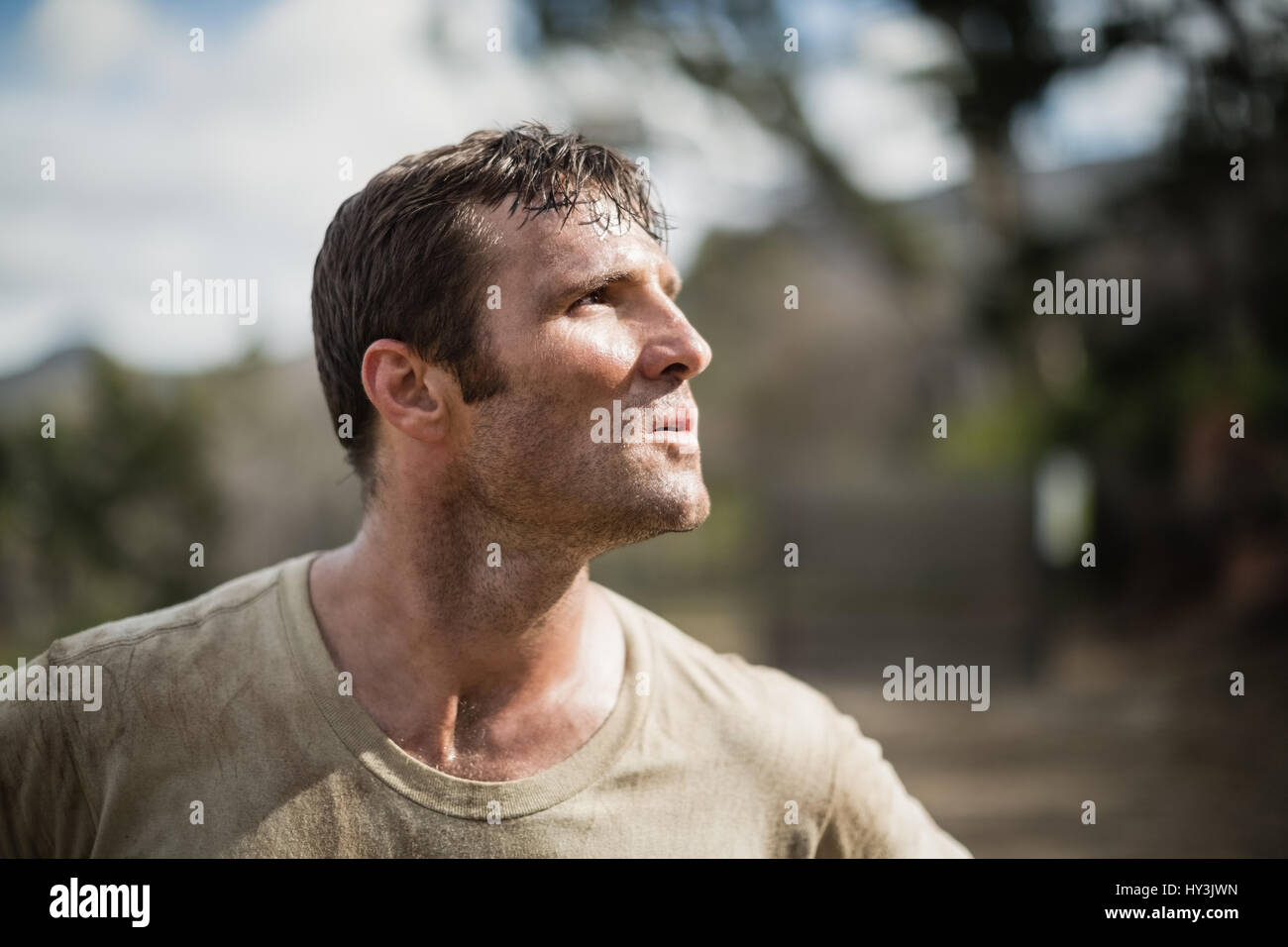 Military man standing during obstacle course in boot camp Stock Photo ...