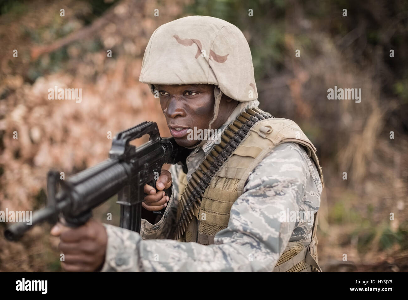 Military soldiers during training exercise with weapon at boot camp ...