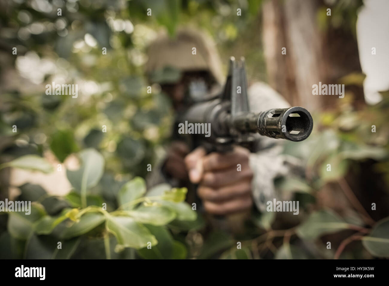 Military soldier guarding with a rifle in boot camp Stock Photo - Alamy