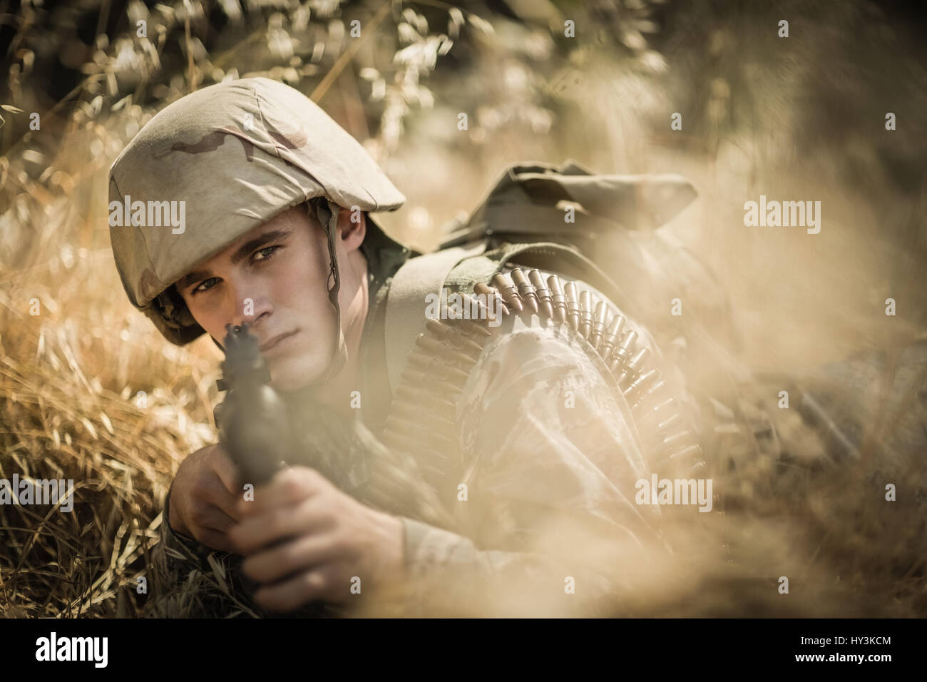 Portrait of military soldier aiming with a rifle in boot camp Stock ...