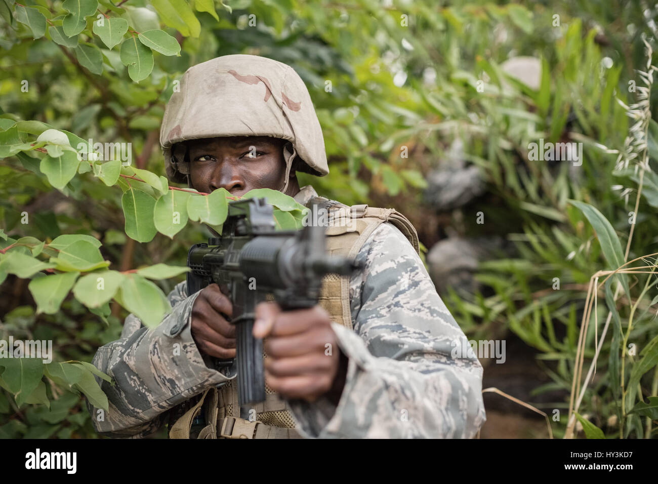 Military soldiers during training exercise with weapon at boot camp ...
