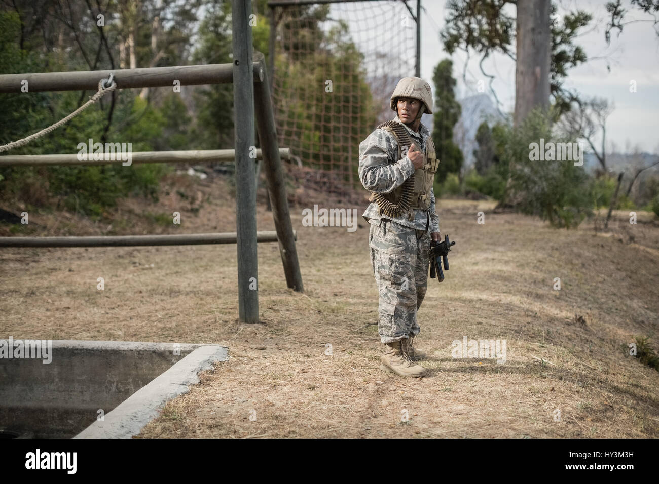 Military soldier during training exercise with weapon at boot camp ...