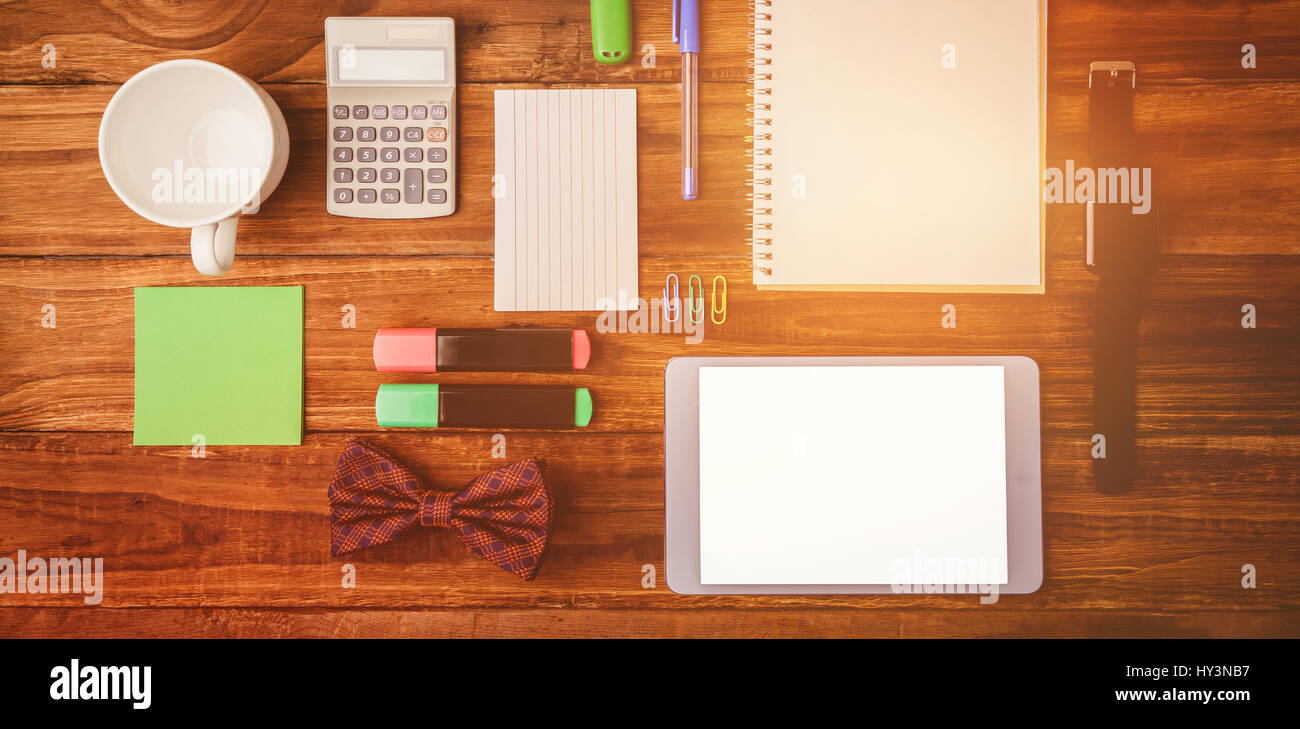 A differetns objects for working on wooden table Stock Photo - Alamy