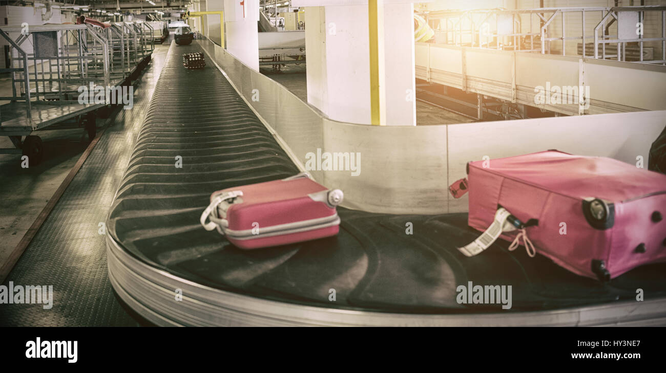 Luggage on baggage claim at airport Stock Photo - Alamy