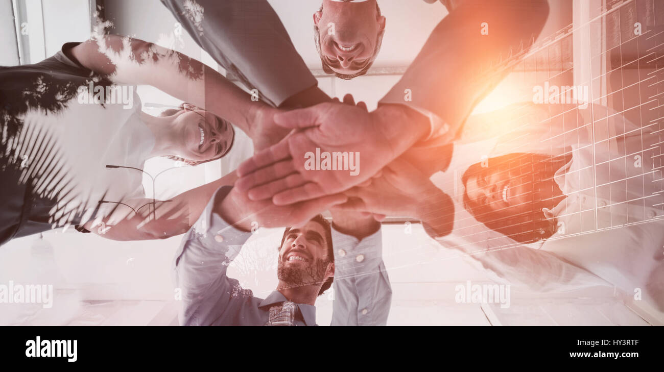 Front side of buildings against businesspeople staking hand Stock Photo ...