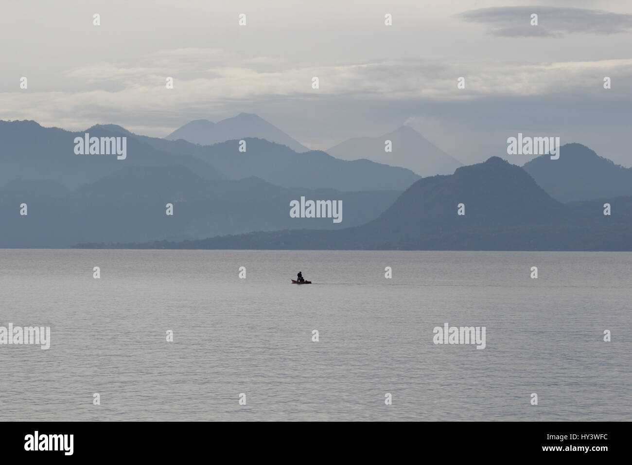Fishing in an ancient Mayan design boat in Lake Atitlan Stock Photo - Alamy