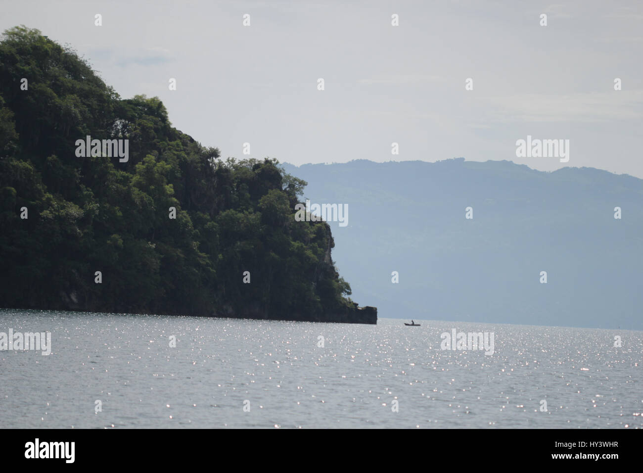 Fishing in an ancient Mayan design boat in Lake Atitlan Stock Photo - Alamy