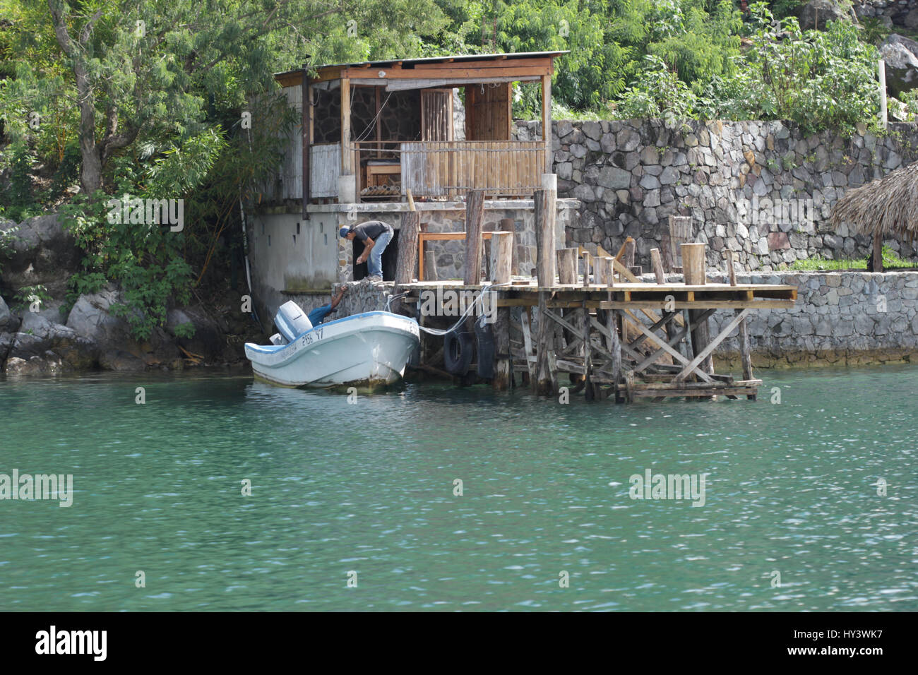 Small wooden handmade harbor for boats port Stock Photo - Alamy