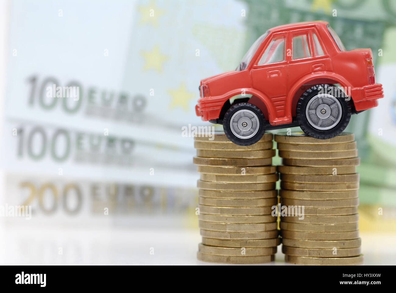 Miniature car on monetary coins, passenger car toll, Miniaturauto auf ...