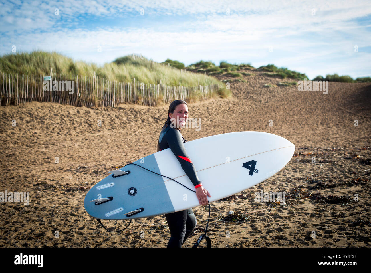 Female surfer at Bantham beach in Devon, England Stock Photo - Alamy