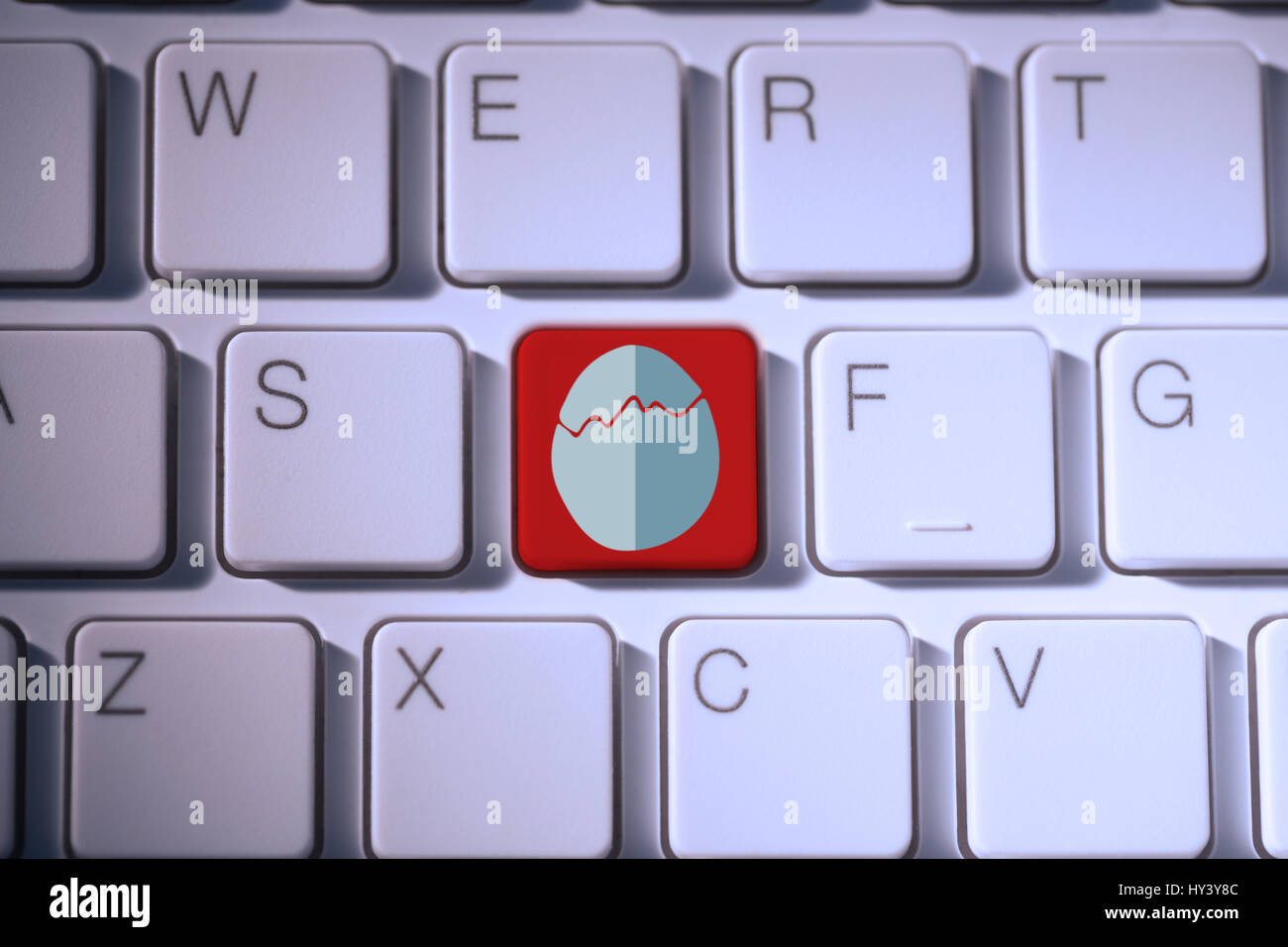 PE047 eggs bs nf against red key on keyboard Stock Photo - Alamy