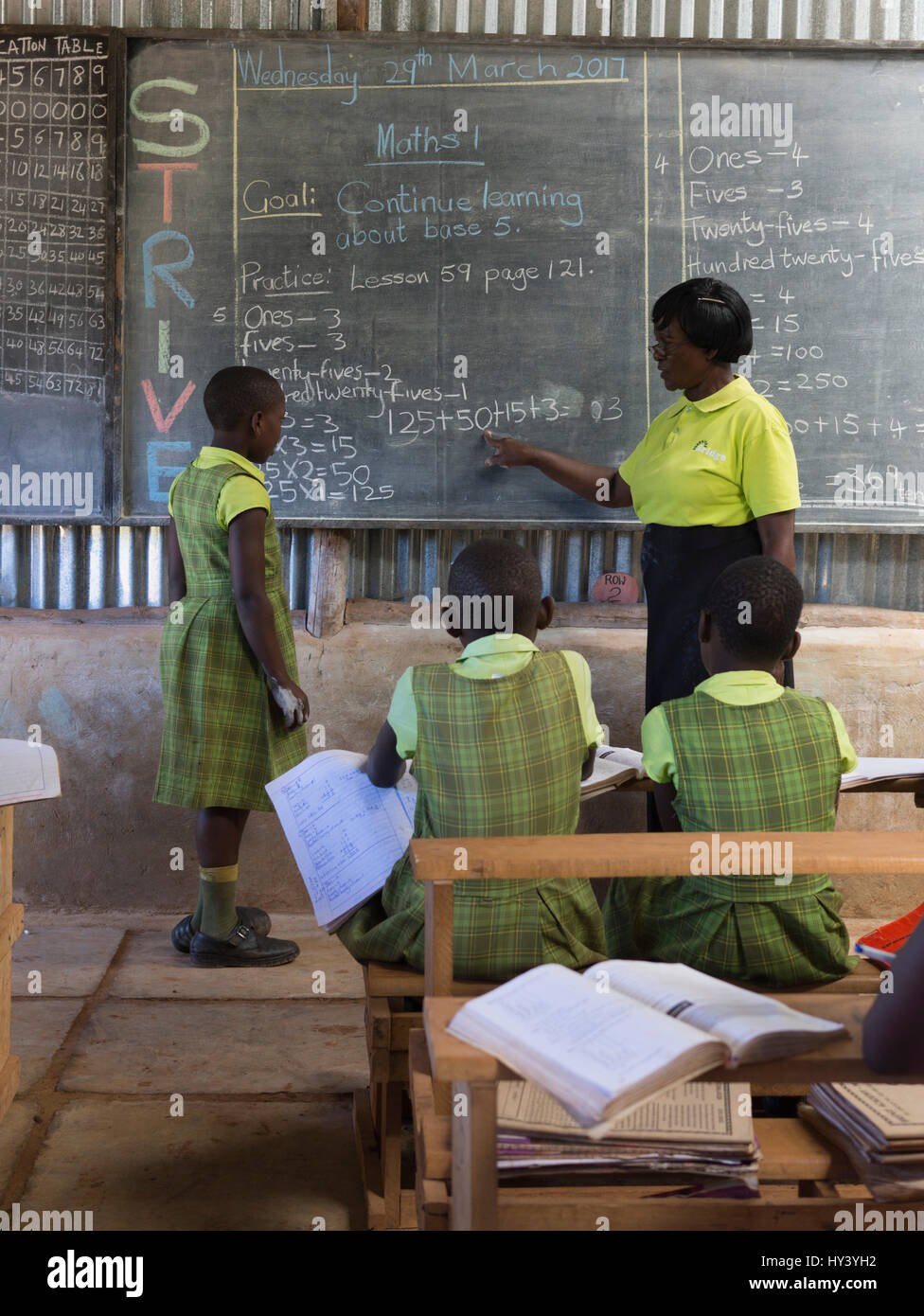 A teacher at a Bridge International Academies primary school in Mpigi ...