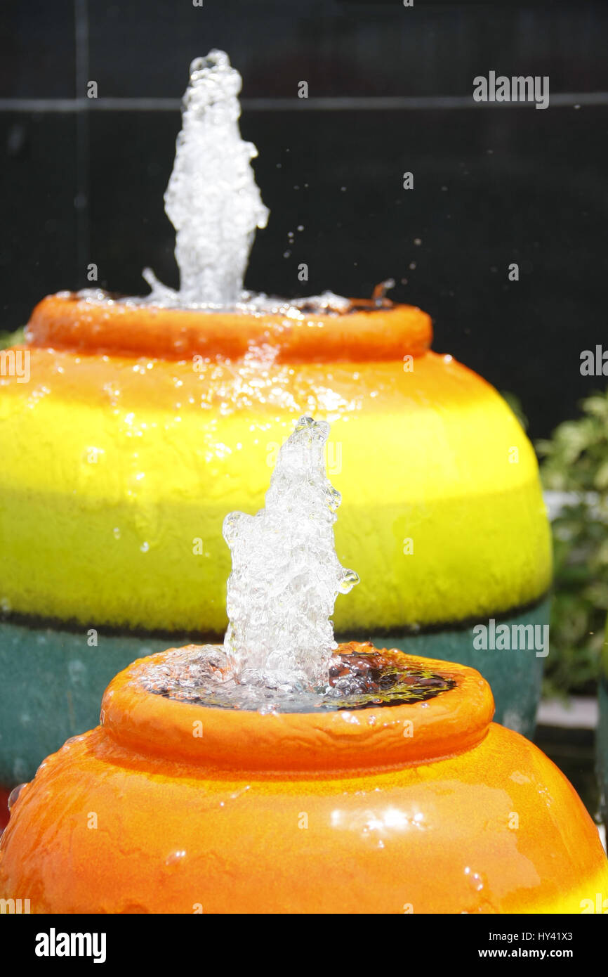 colorful Jar fountain in the garden pool Stock Photo - Alamy